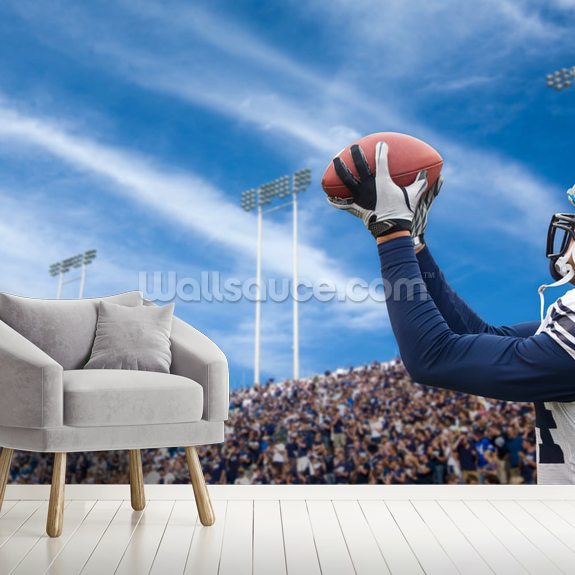 American Football-speler vangt een touchdownpassmuurschildering ...